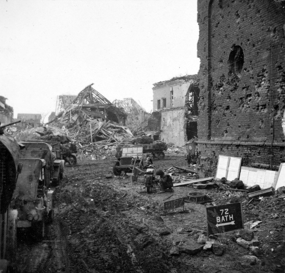 Allied vehicles passing through the ruins of Uedem, Germany, 1945 ...