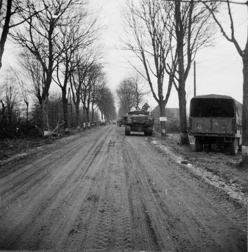 Sherman tanks and trucks on a road south of Uedem, Germany, 1945 ...