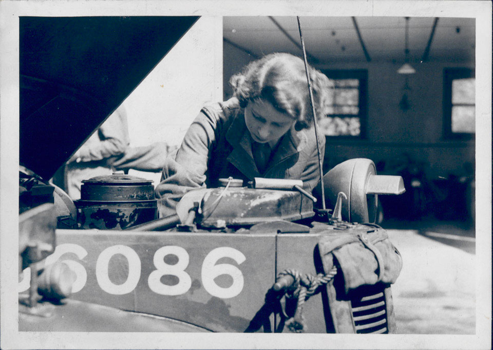 Princess Elizabeth examining the engine of an Austin 10 'Tilly' light ...