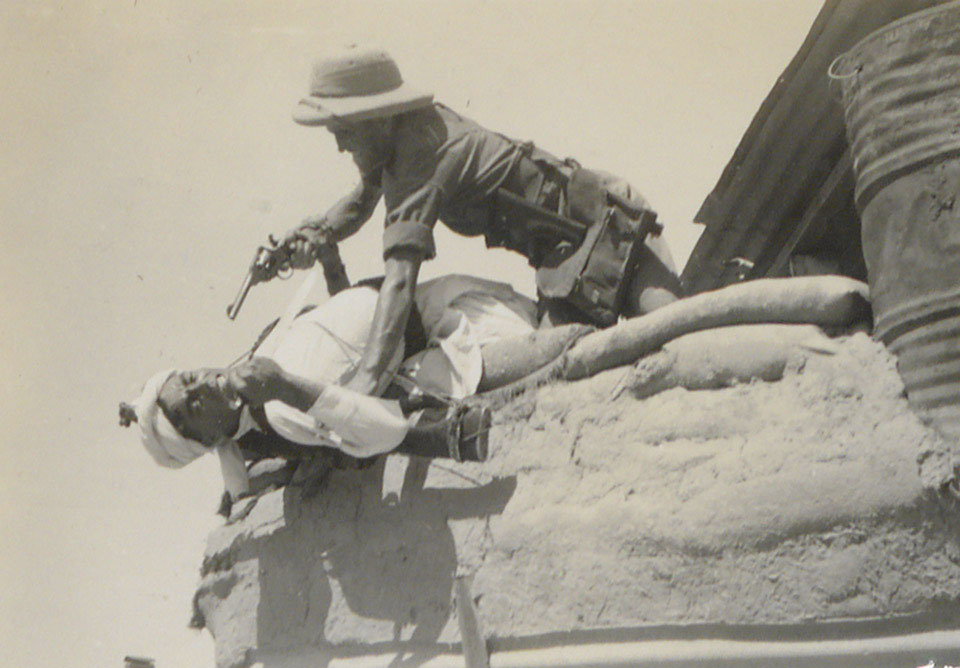Staged scene of combat with a British soldier with a pistol ...