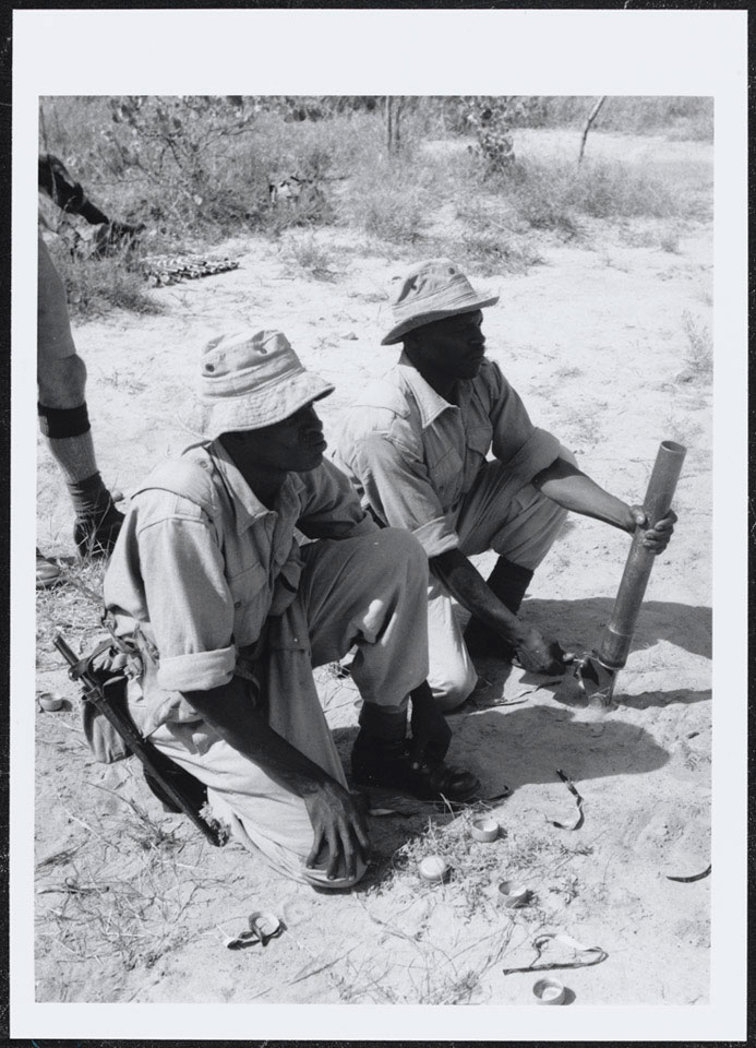 4th (Uganda) Battalion, King's African Rifles, firing a 2-inch mortar ...
