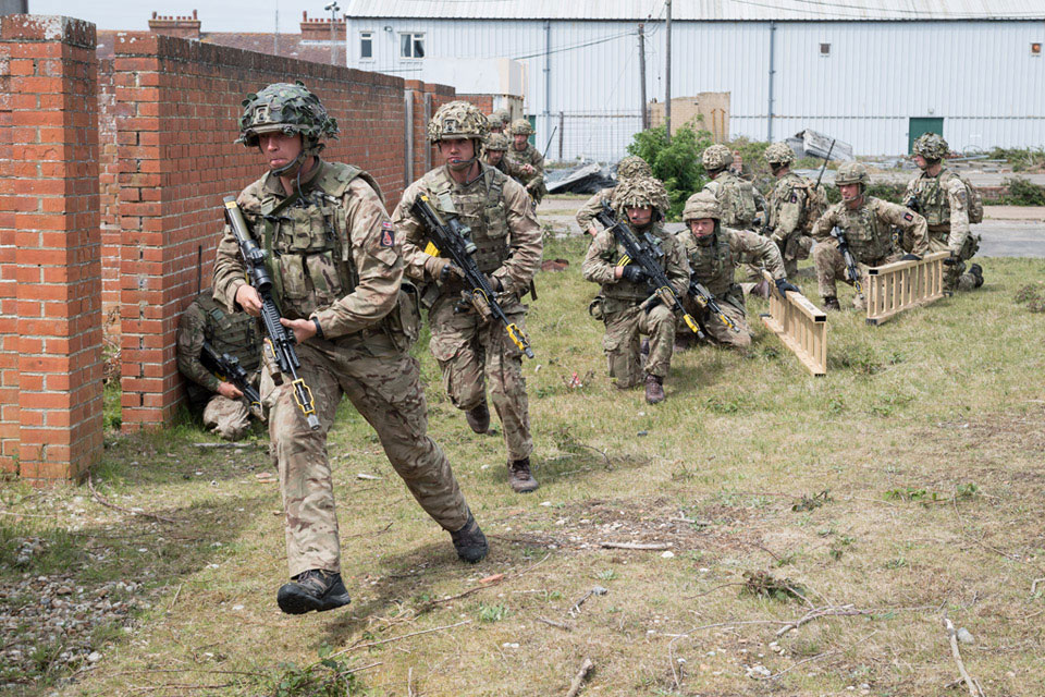 Soldiers from the Royal Anglian Regiment engaged in urban warfare ...