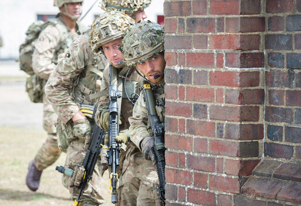 Soldiers from the Royal Anglian Regiment engaged in urban warfare ...