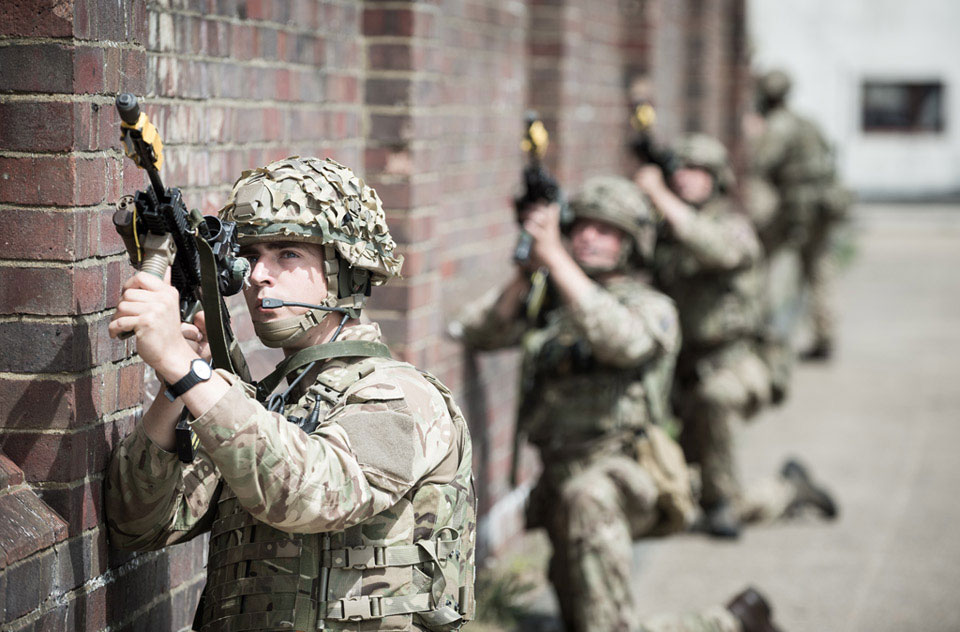 Soldiers from the Royal Anglian Regiment engaged in urban warfare ...