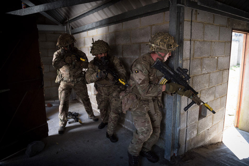 Soldiers from the Royal Anglian Regiment engaged in urban warfare ...
