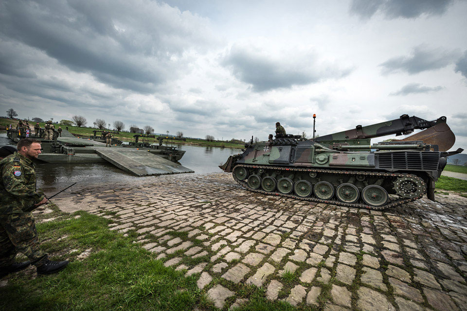German Badger armoured engineer vehicle approaching a pontoon bridge ...